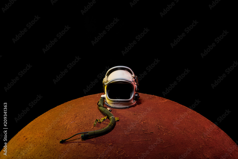 helmet from spacesuit lying on mars planet in black universe Stock ...
