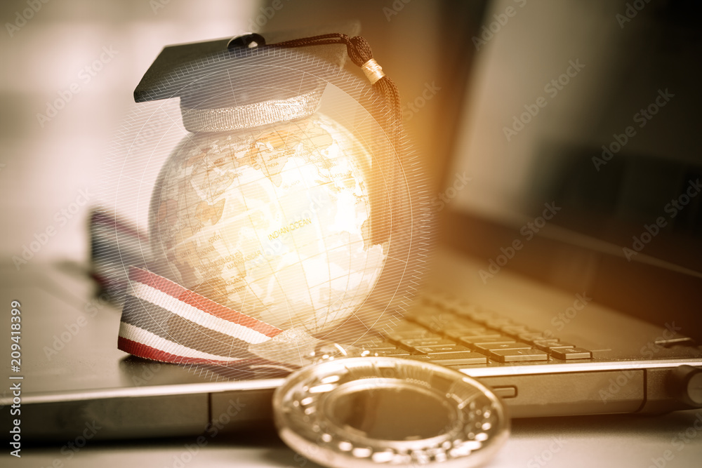 Graduate study abroad concept, Graduation cap on top Earth globe model ...
