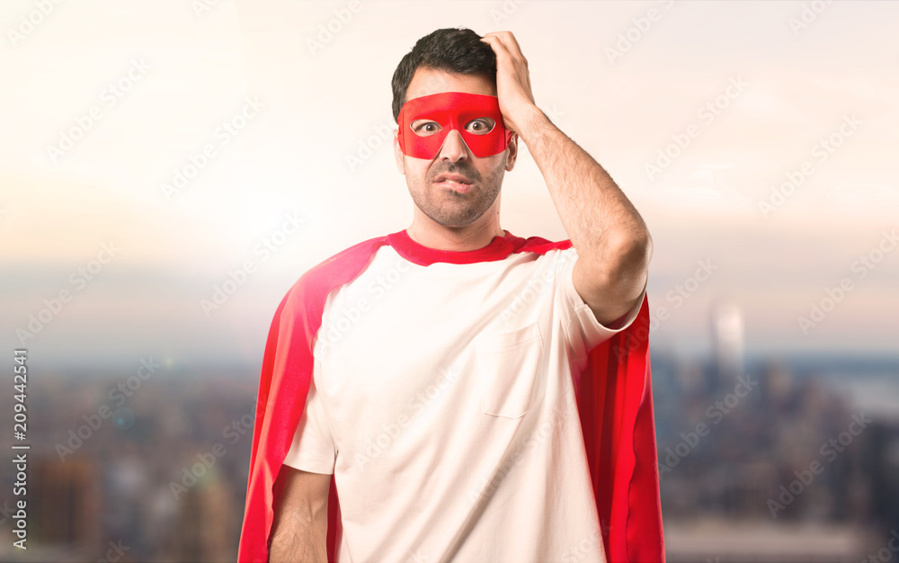 Superhero man with mask and red cape with an expression of frustration ...