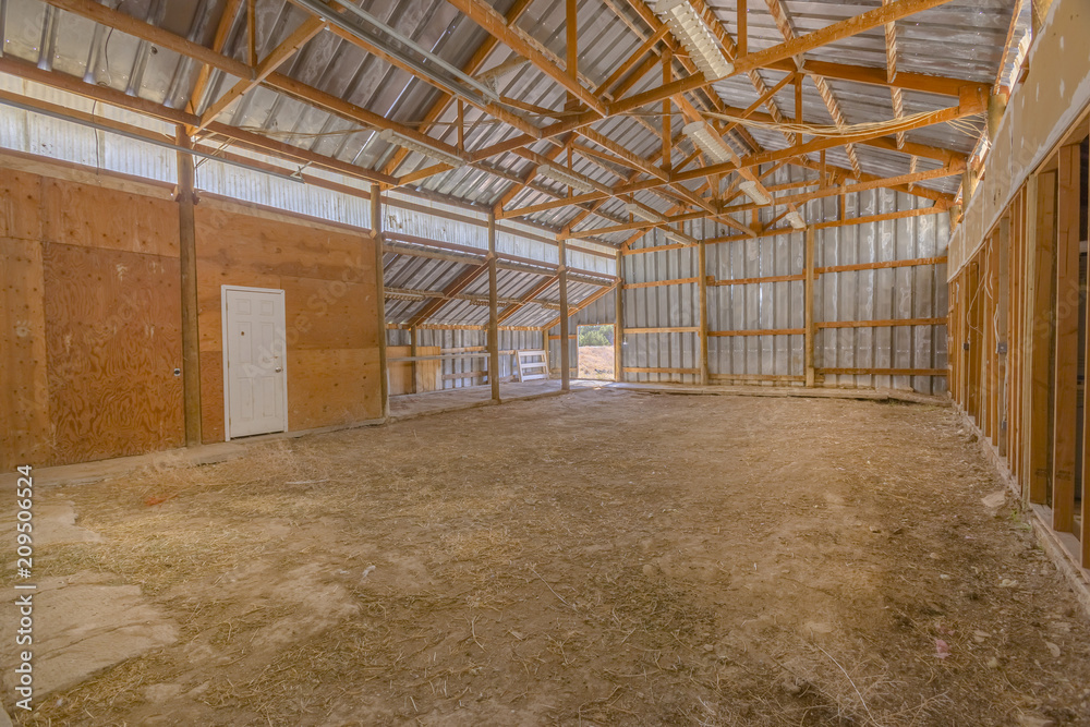 Interior of empty barn with wooden beams Stock Photo | Adobe Stock