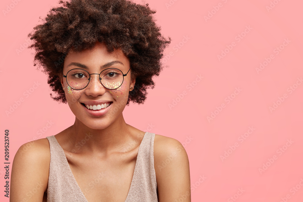 Horizontal shot of adorable young female student prepares for ...