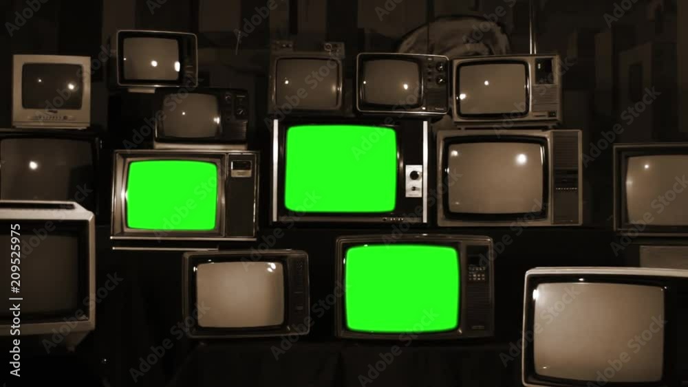 Many Tvs with Green Screens Turning On. Sepia Tone. Zoom Out. You can ...