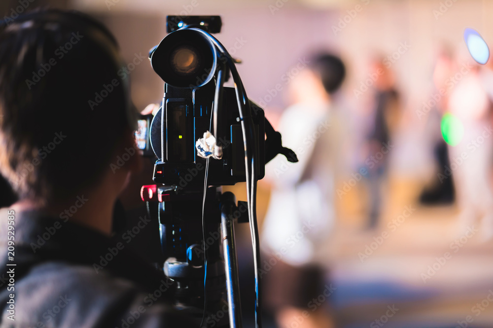 professional cameraman record live concert with beam spot and light ...