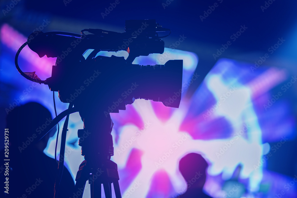 professional cameraman record live concert with beam spot and light ...