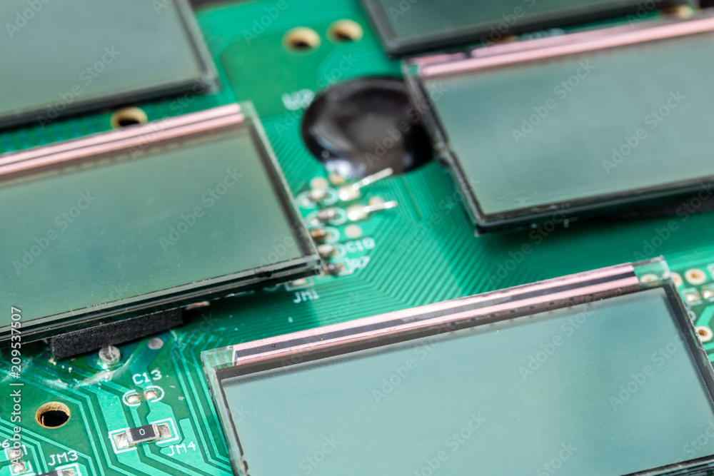 Fotka „Miniature LCD panels on the motherboard. Circuit Board close-up ...