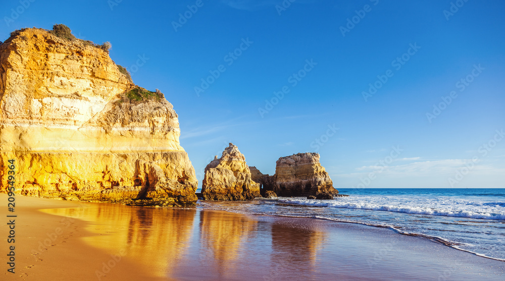 Algarve, Portugal, a stunning sea ocean landscape with yellow rocks and ...