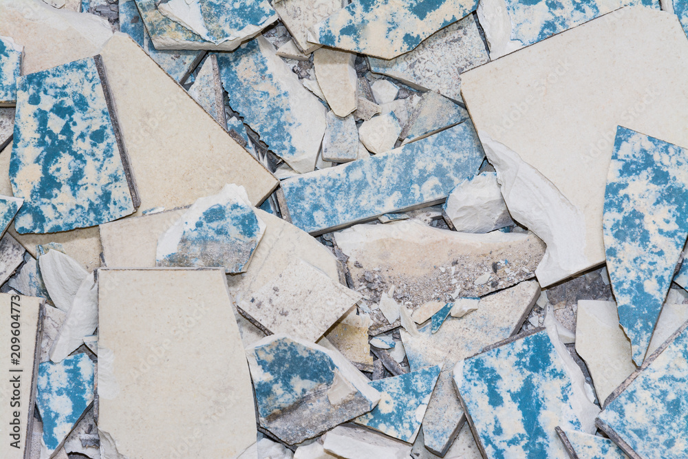 Broken tiles from demolition of an old flooring. Texture of worn retro ...