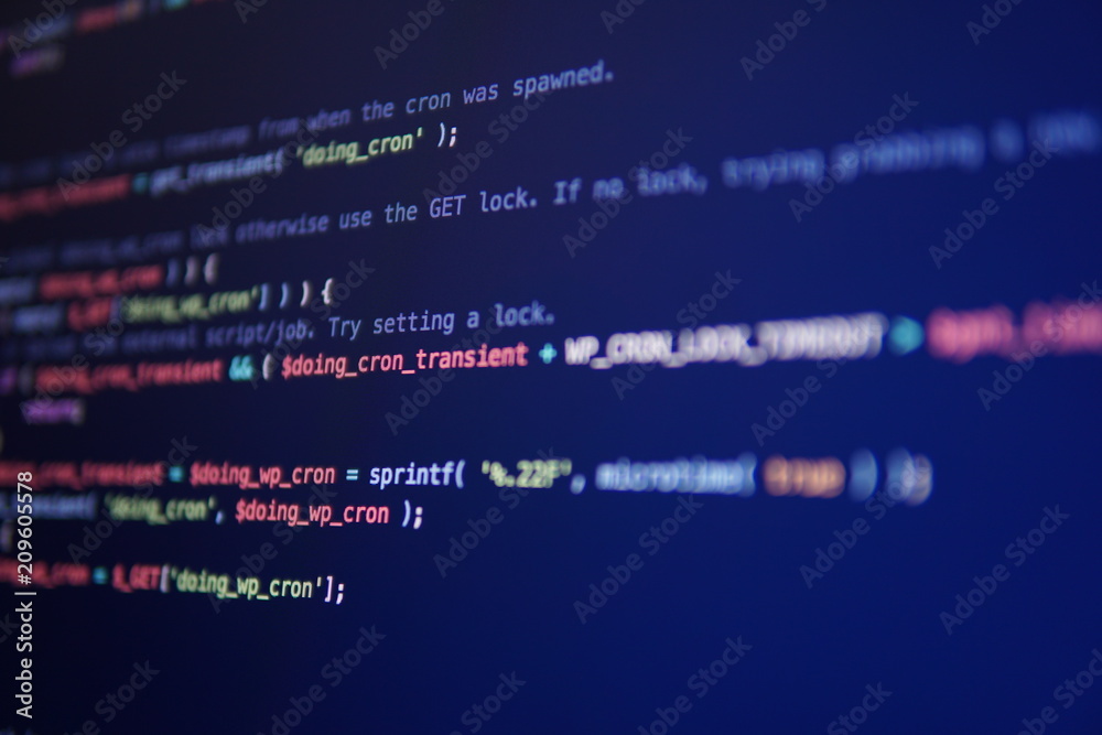 Simple website HTML code with colorful tags in browser view on dark background. Software ...