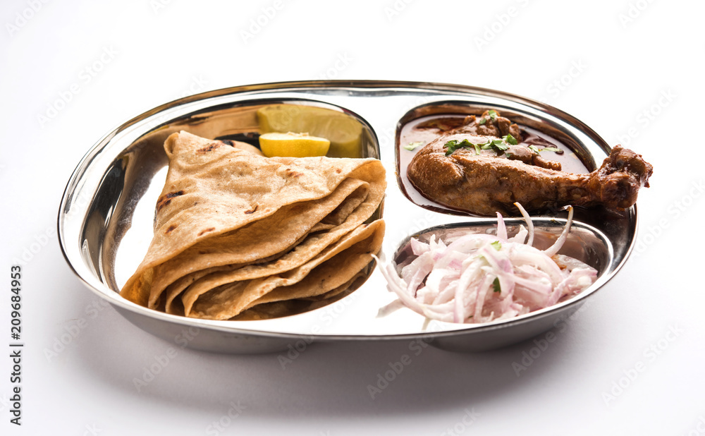 Mini chicken curry Thali with chapati/roti, popular indian lunch/dinner ...