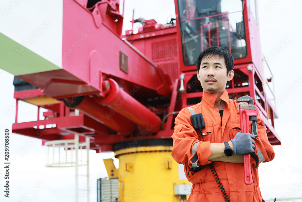 operator recording operation of oil and gas process at oil and rig ...