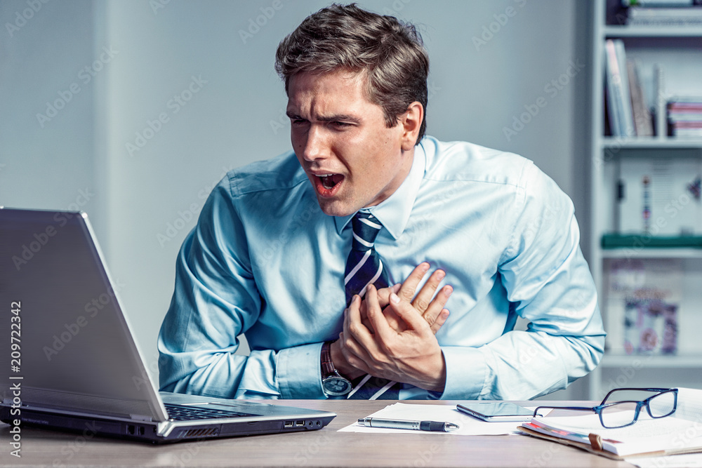 Office manager having heart attack. Photo of young man holding hand on ...