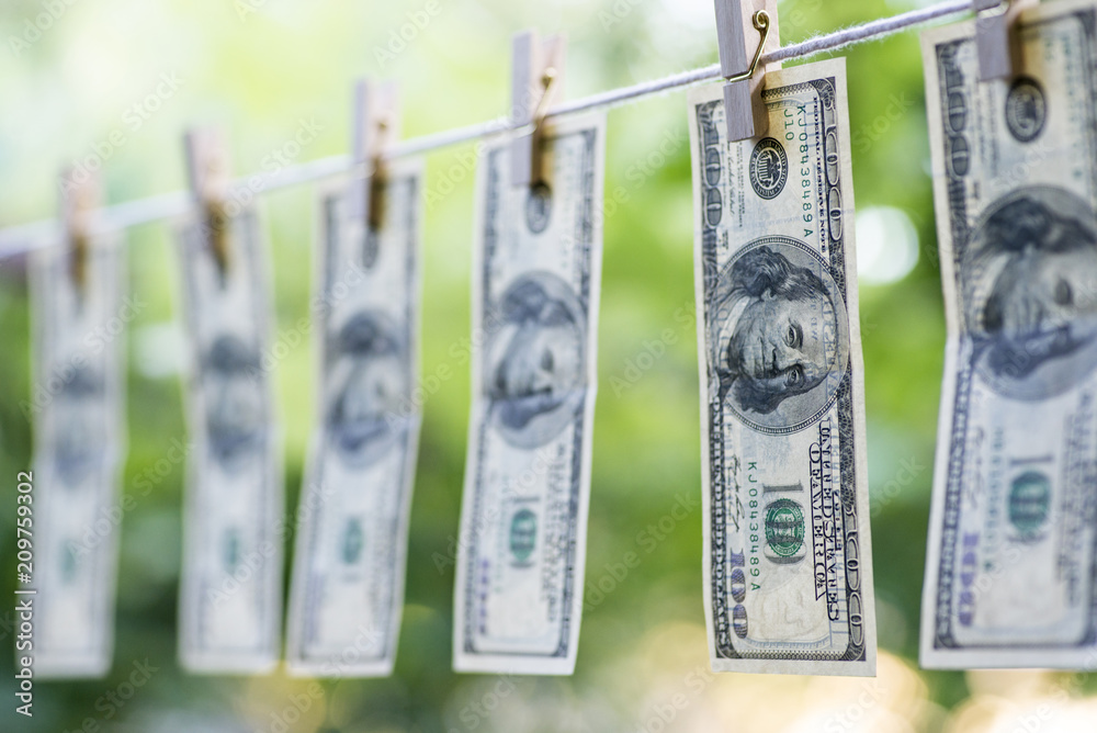 Money Laundering. Money Laundering US dollars hung out to dry. 100 ...