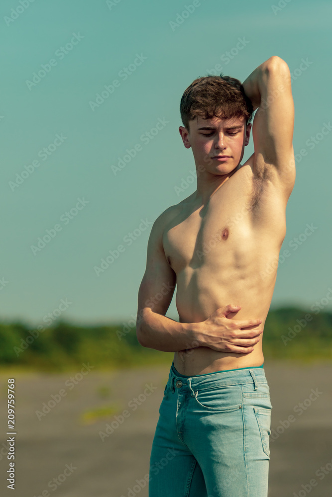 Young adult male shirtless outdoors Stock Photo | Adobe Stock