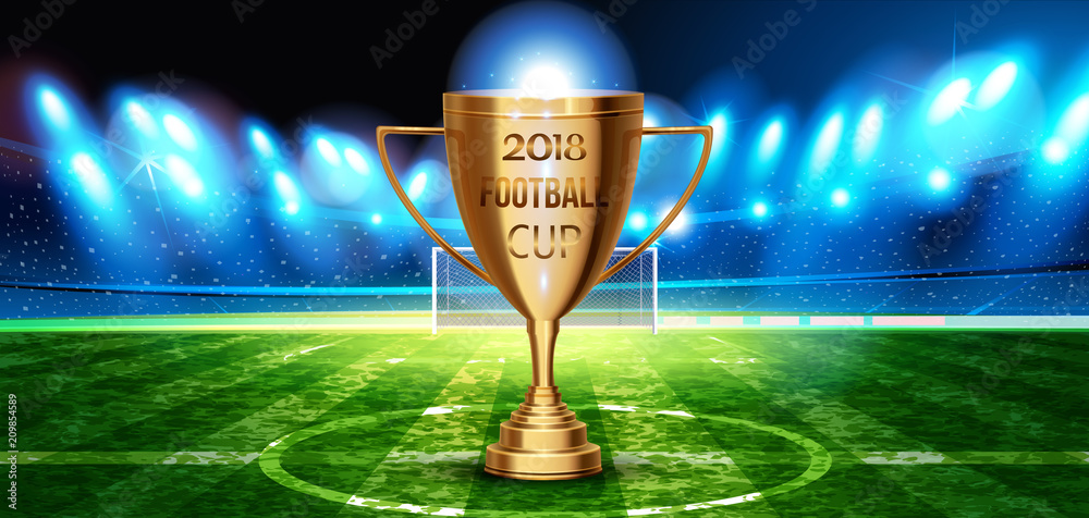 Football cup in the soccer arena on a background of grass field. Night ...