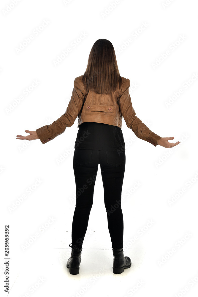 full length portrait of brunette girl wearing brown leather jacket ...