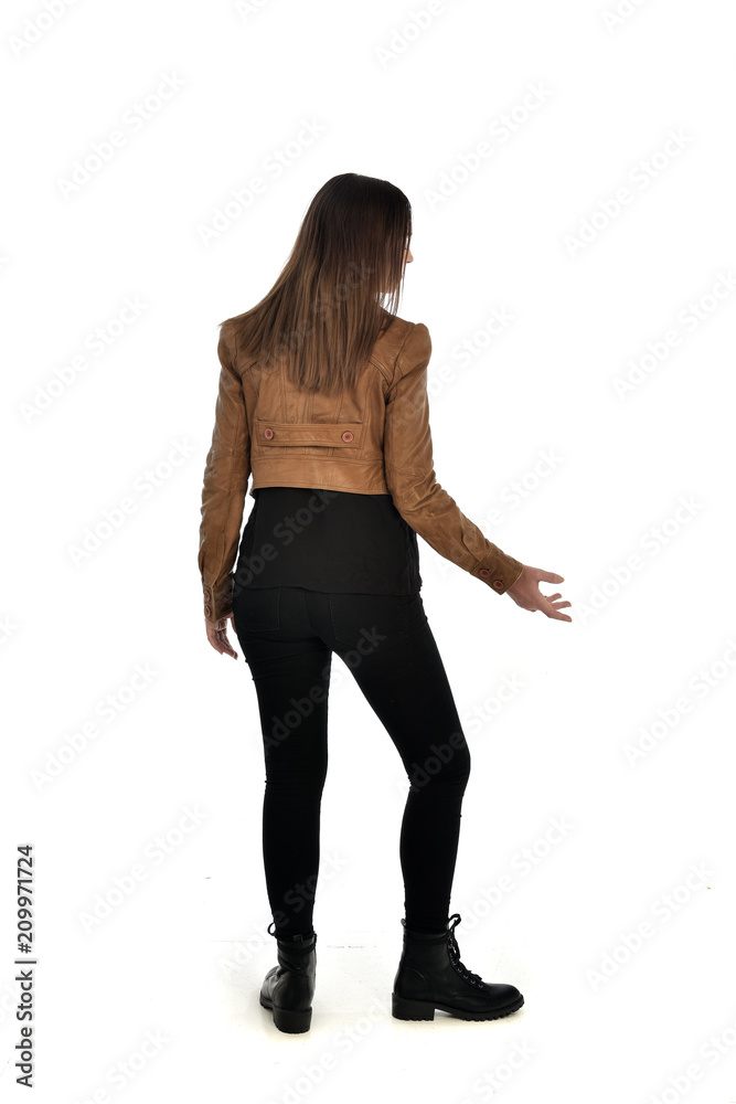 full length portrait of brunette girl wearing brown leather jacket ...