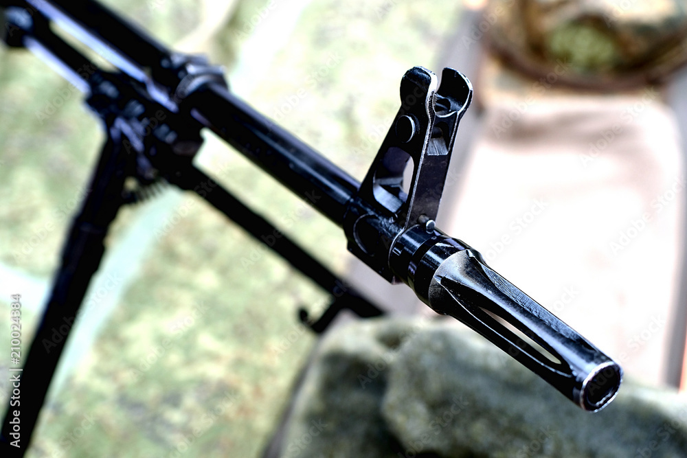 Trunk of the Russian machine gun on the background of colors of the ...