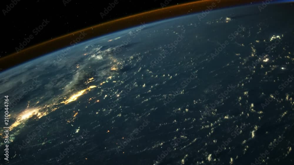 Clouds and lightning, as seen from space, cast long shadows on the ...