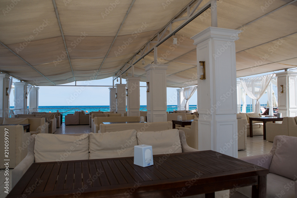 Interior of Elite comfortable beach resort with palm trees and pools ...