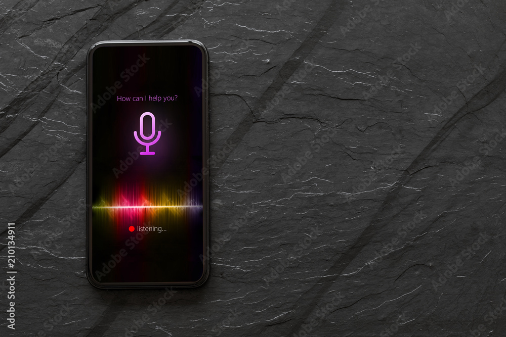 Mobile phone with activated voice assistant. Stock Photo | Adobe Stock