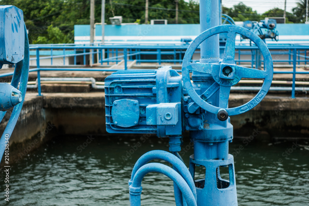 Blue valve at water treatment plant Stock Photo | Adobe Stock