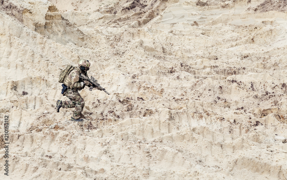 Army soldier or commando with assault rifle in ocp camouflage combat ...