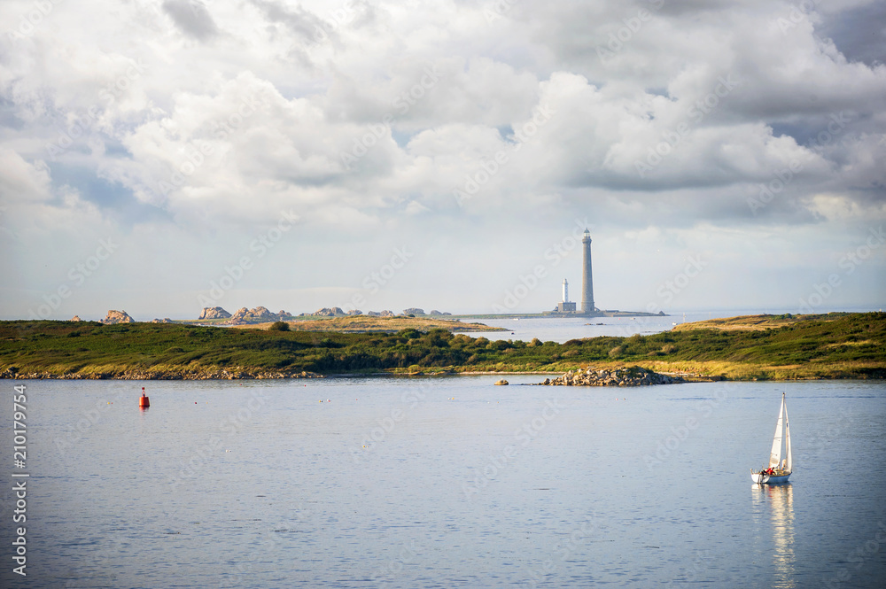 The Ile Vierge lighthouse at sunset, on the north coast of Finistère ...