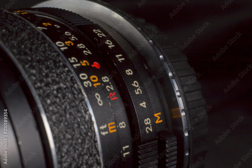 DSLR vintage wide lens close up with focus ring measures. Precise ...