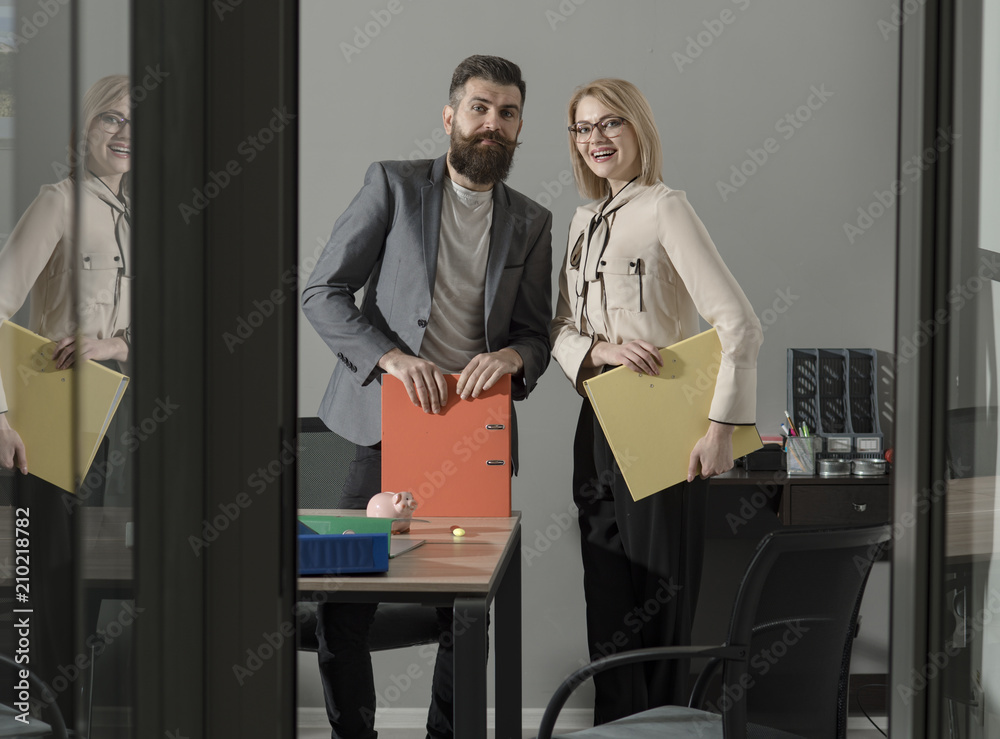 Working and communicating together. Happy colleagues in modern office ...