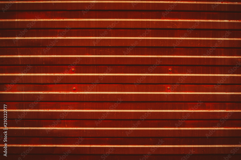 Red old stained and scruffy metal surface with bolts close up. Detailed ...