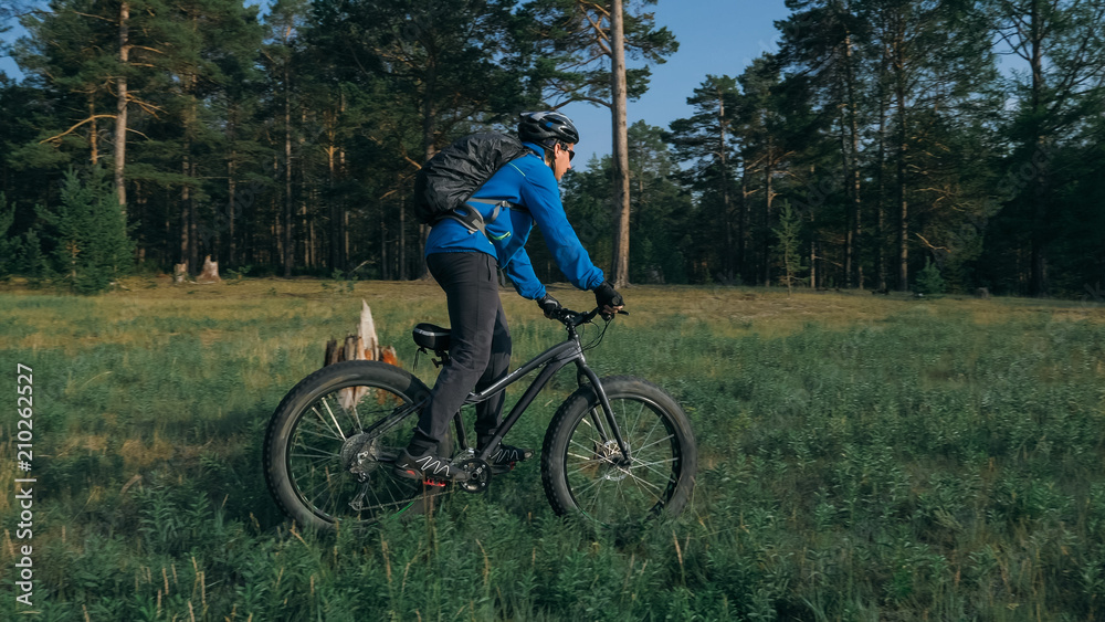 Fat bike also called fatbike or fat-tire bike in summer riding in the ...