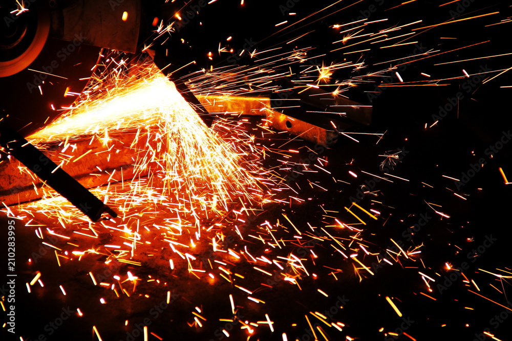 The worker cut steel with an industrial circular saw cutting have split ...