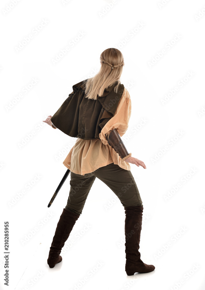 full length portrait of girl wearing medieval costume with sword ...