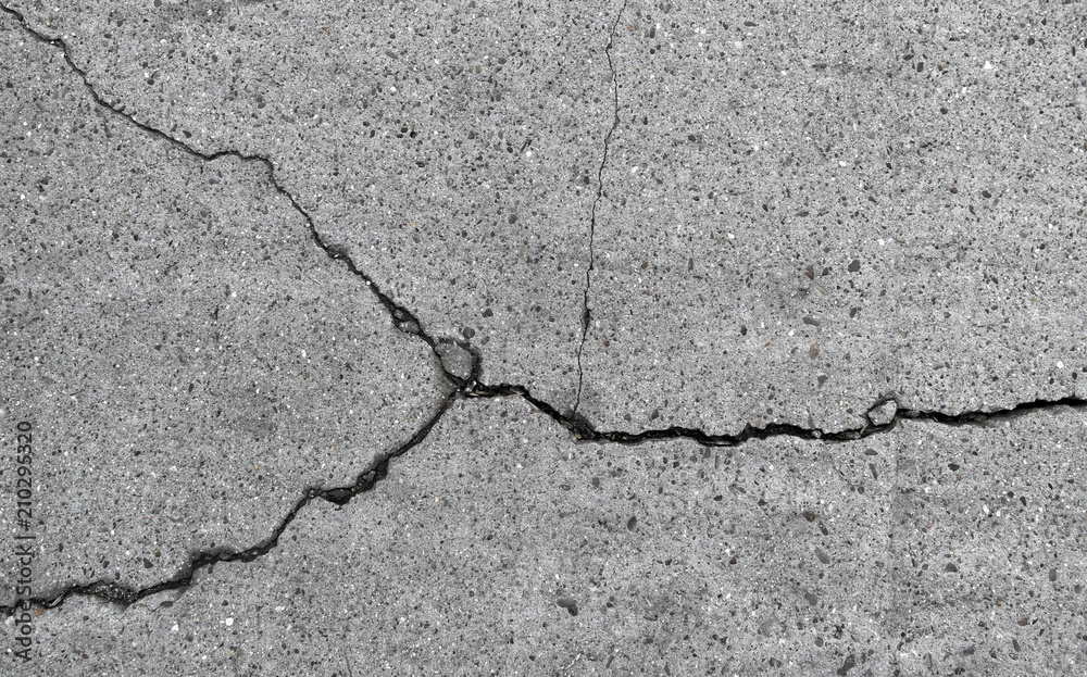 Old worn and cracked asphalt. Cracked asphalt texture or background ...