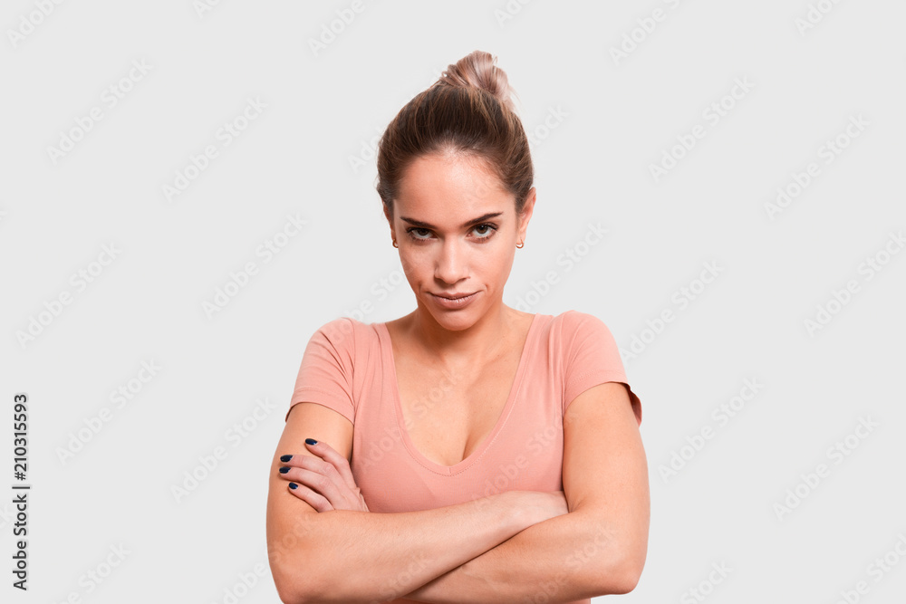 Angry woman with arms crossed Stock Photo | Adobe Stock