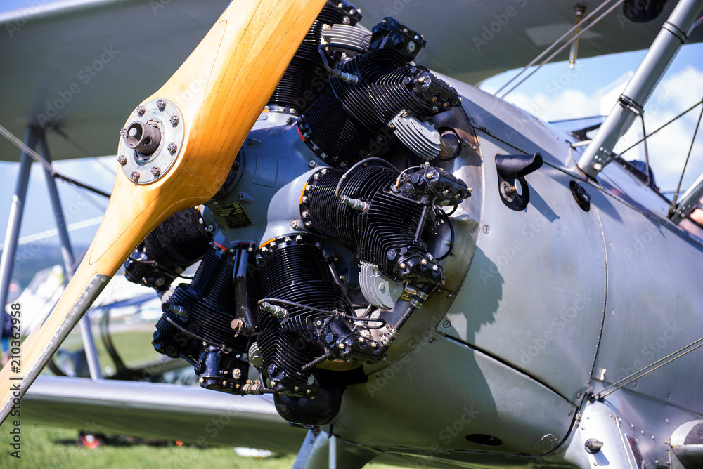Vintage aircraft with radial engine and wooden propeller, close up of ...