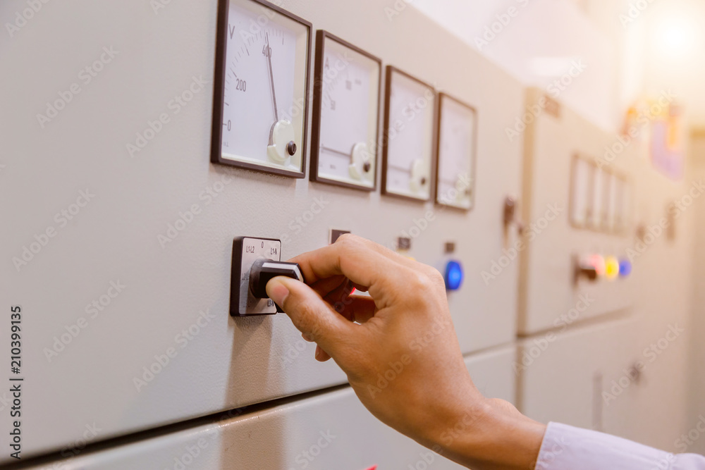 Engineer is check voltage or current by voltmeter in control panel of ...
