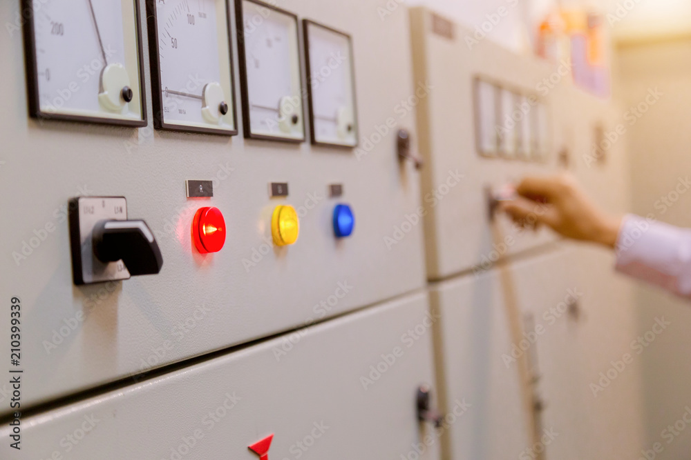 Engineer is check voltage or current by voltmeter in control panel of ...