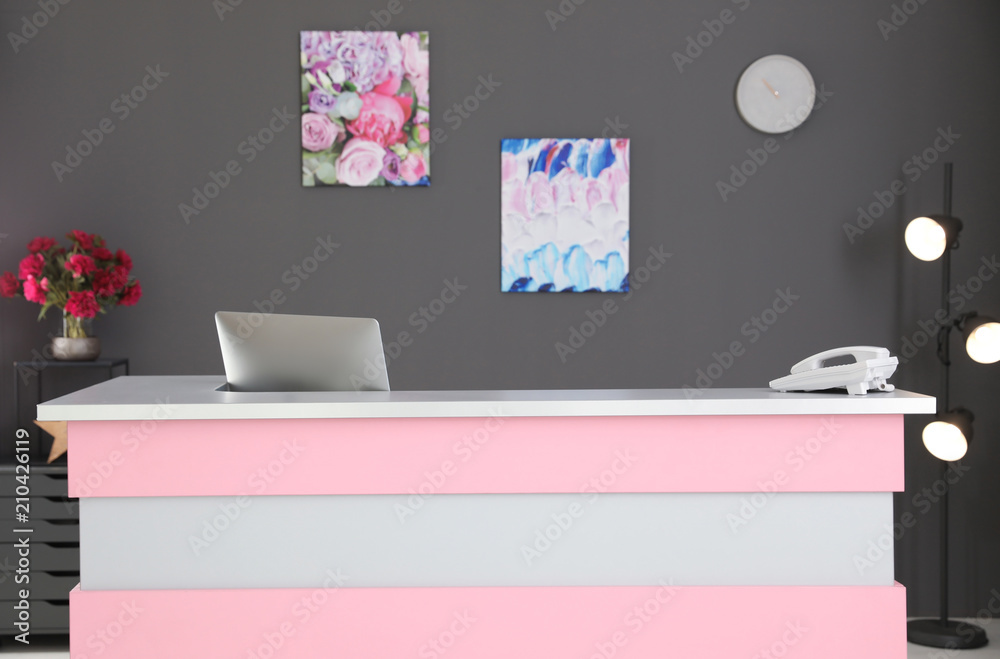 Beauty salon interior with computer on desk. Receptionist workplace ...