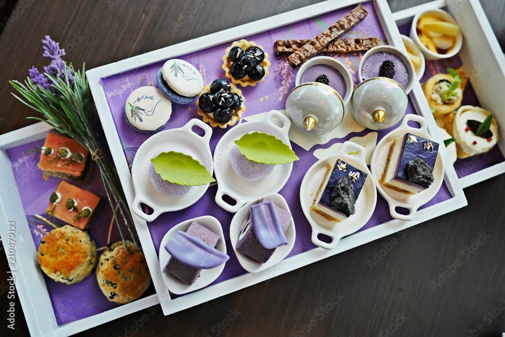 A colorful and delicious set of afternoon tea party in lavender theme ...