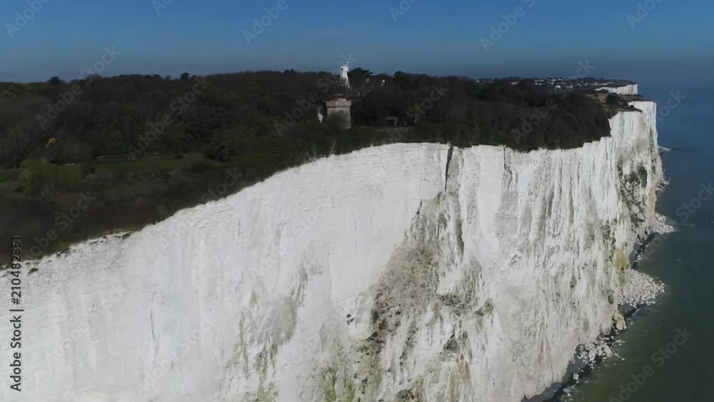 Aerial footage of ancient lighthouse on top of White Cliffs of Dover ...