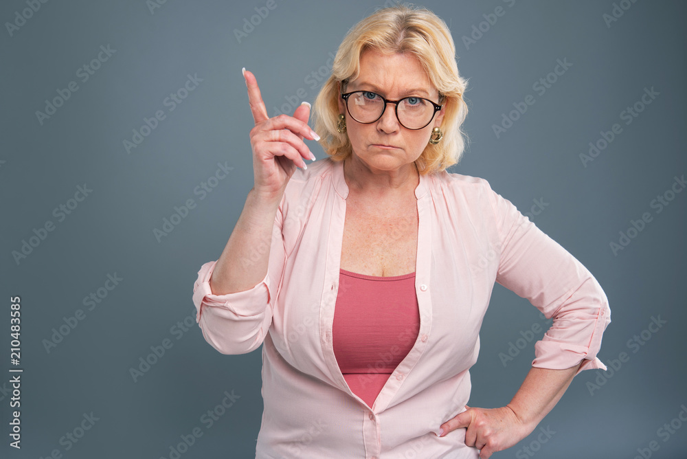 Mad At You Angry Senior Woman Raising Her Index Finger And Being About To Scold Someone While
