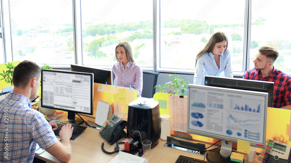 Team working in office. Monitor typing and new project discussing ...