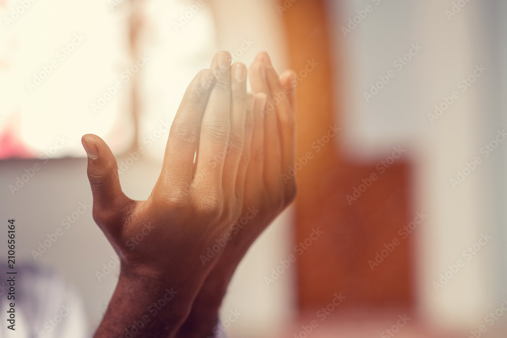Hand of muslim black man people praying with mosque interior background ...