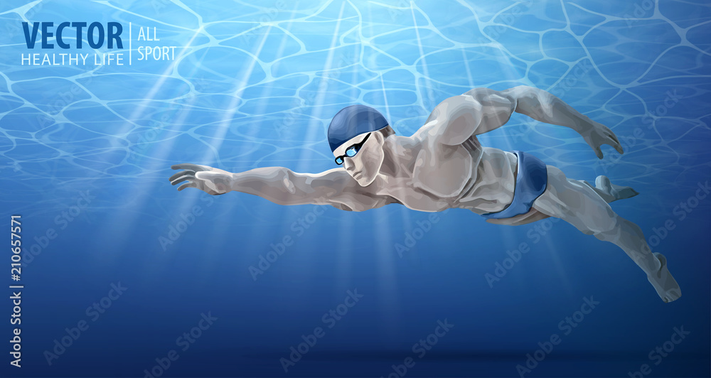 Professional male swimmer inside swimming pool. A man dives into the ...