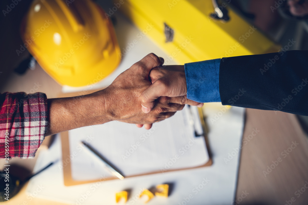 Group of officer teamwork is happy and shake hands to celebrate in ...