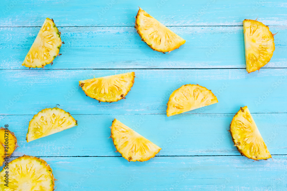 Tropical pineapple slices on wood plank blue color. frame layout summer ...