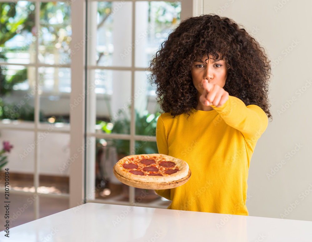 African american woman ready to eat tasty pepperoni pizza at home ...