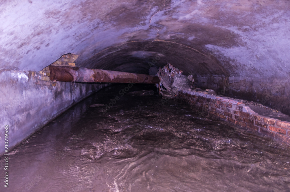 Sewage trash underground. Garbage in the sewer. Stock Photo | Adobe Stock