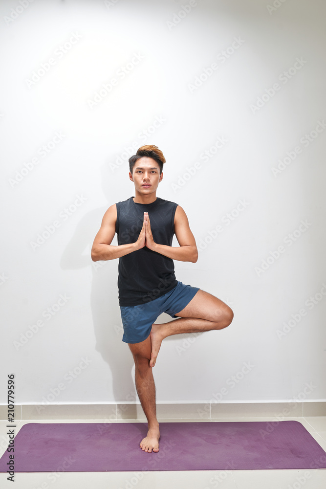 Fitness man plank workout training at white background indoors. Young ...